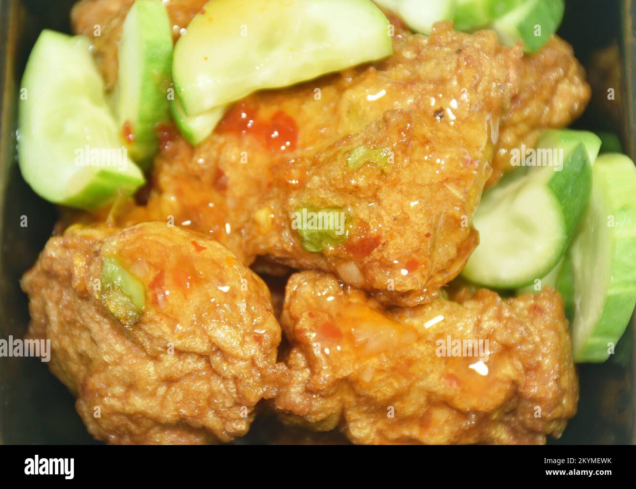 deep fried fish patty dressing slice cucumber in sweet chili sauce on ...
