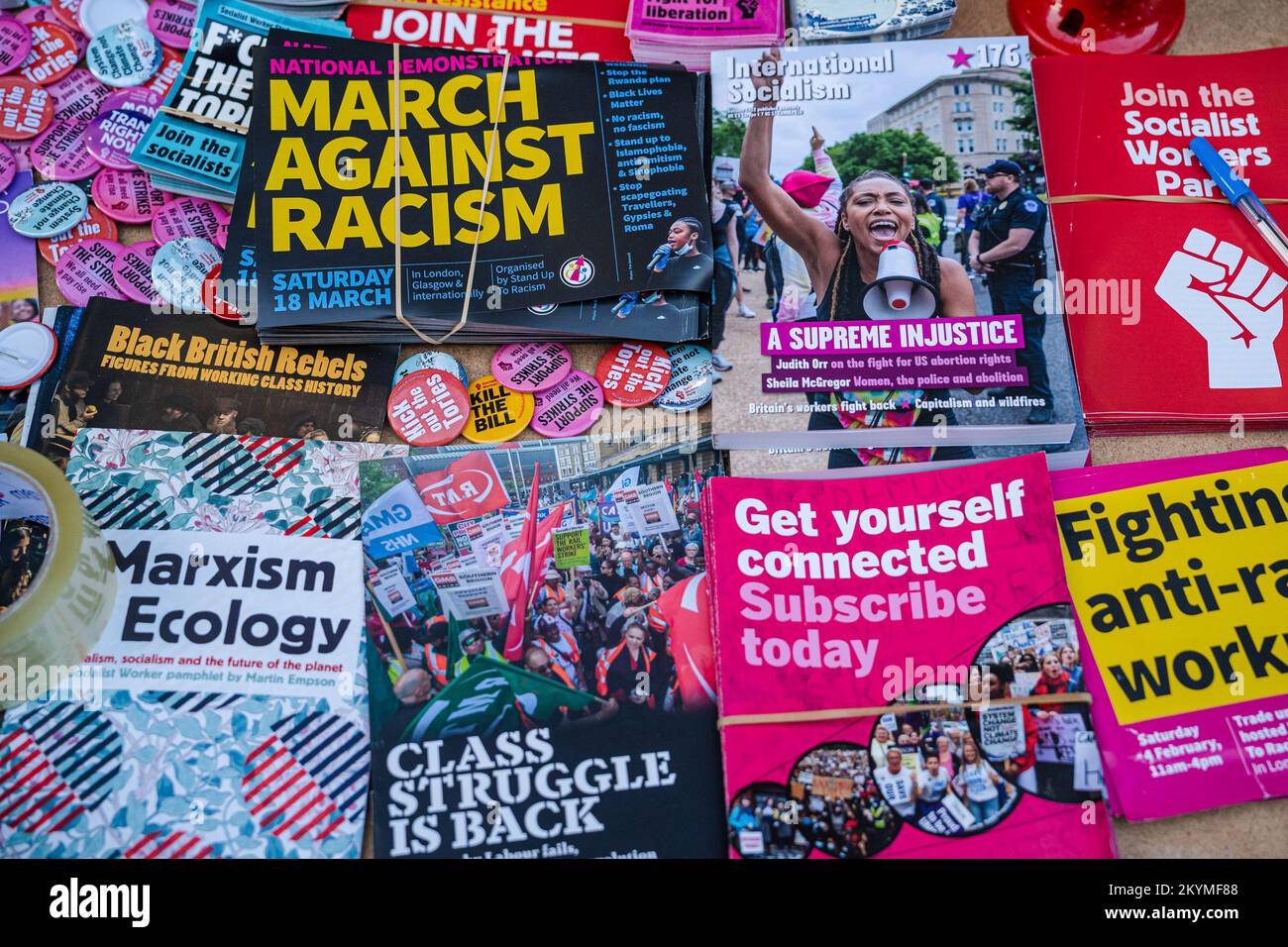 Posters and flyers are seen during the rally. Thousands of people ...