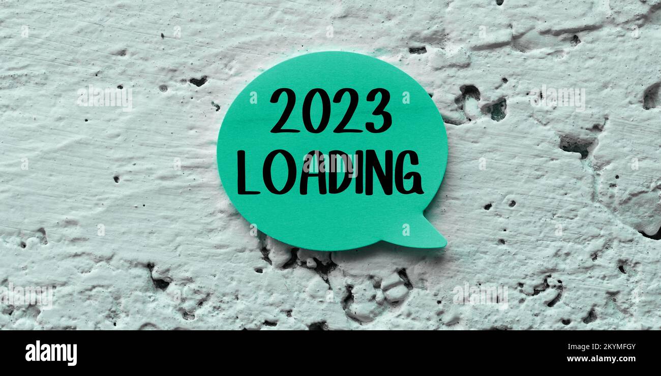 Hand writing sign 2023 Loading. Word Written on Advertising the upcoming year Forecasting the ...