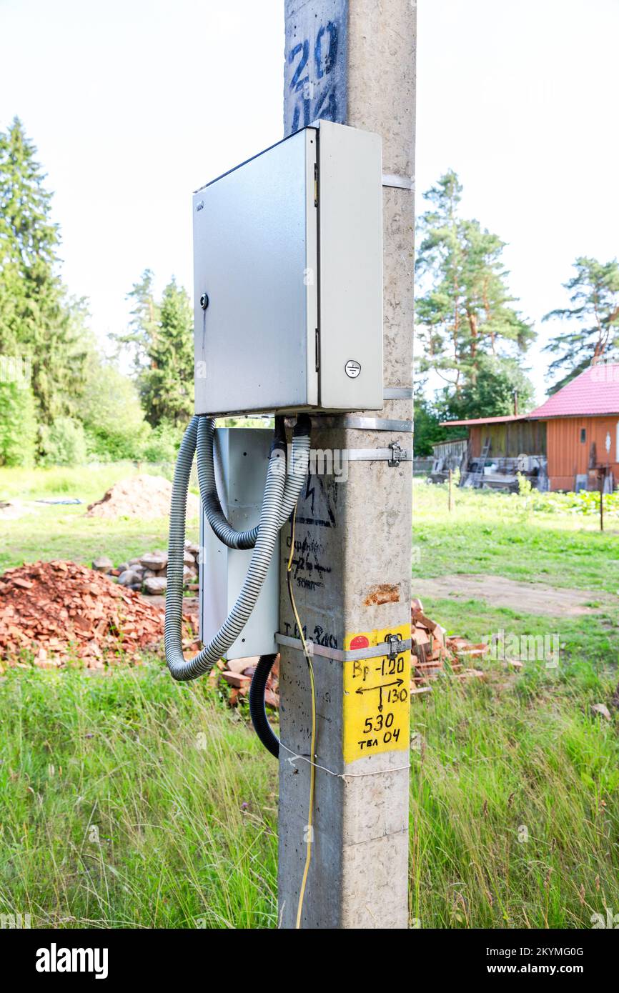 Electrical distribution board on a power line support in summer ...