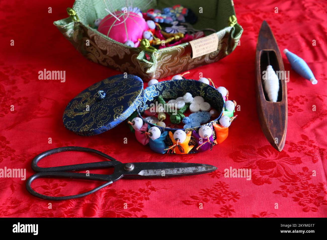 Chinese tailor accessories in silk background Stock Photo - Alamy