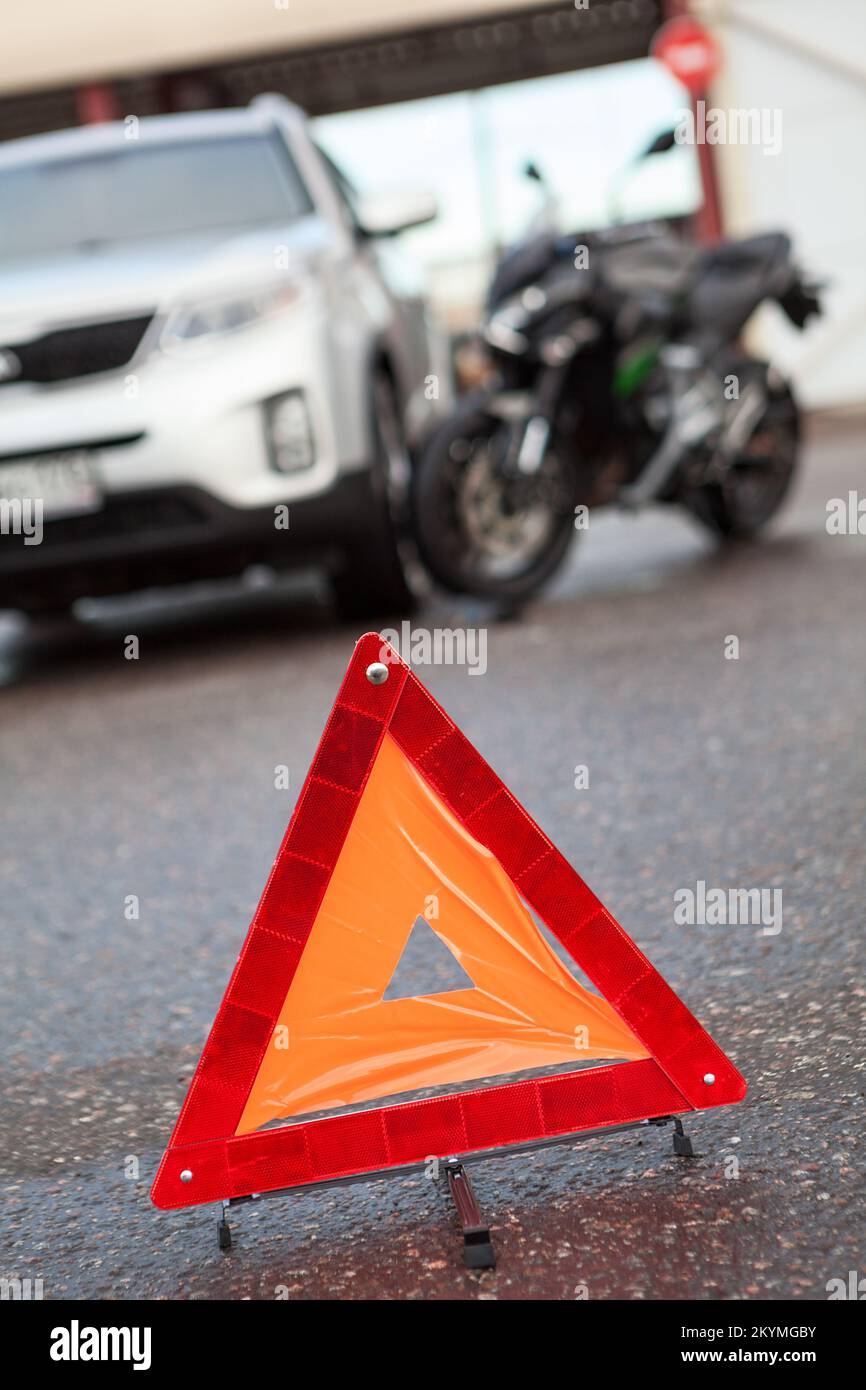Emergency sign and car accident with motorcycle Stock Photo - Alamy