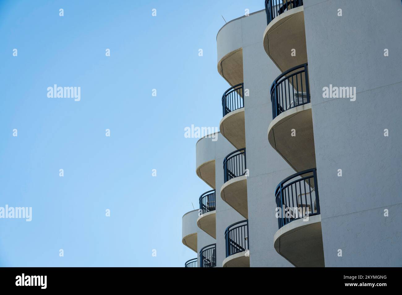 Corner of a building with curved balconies in a low angle view at ...