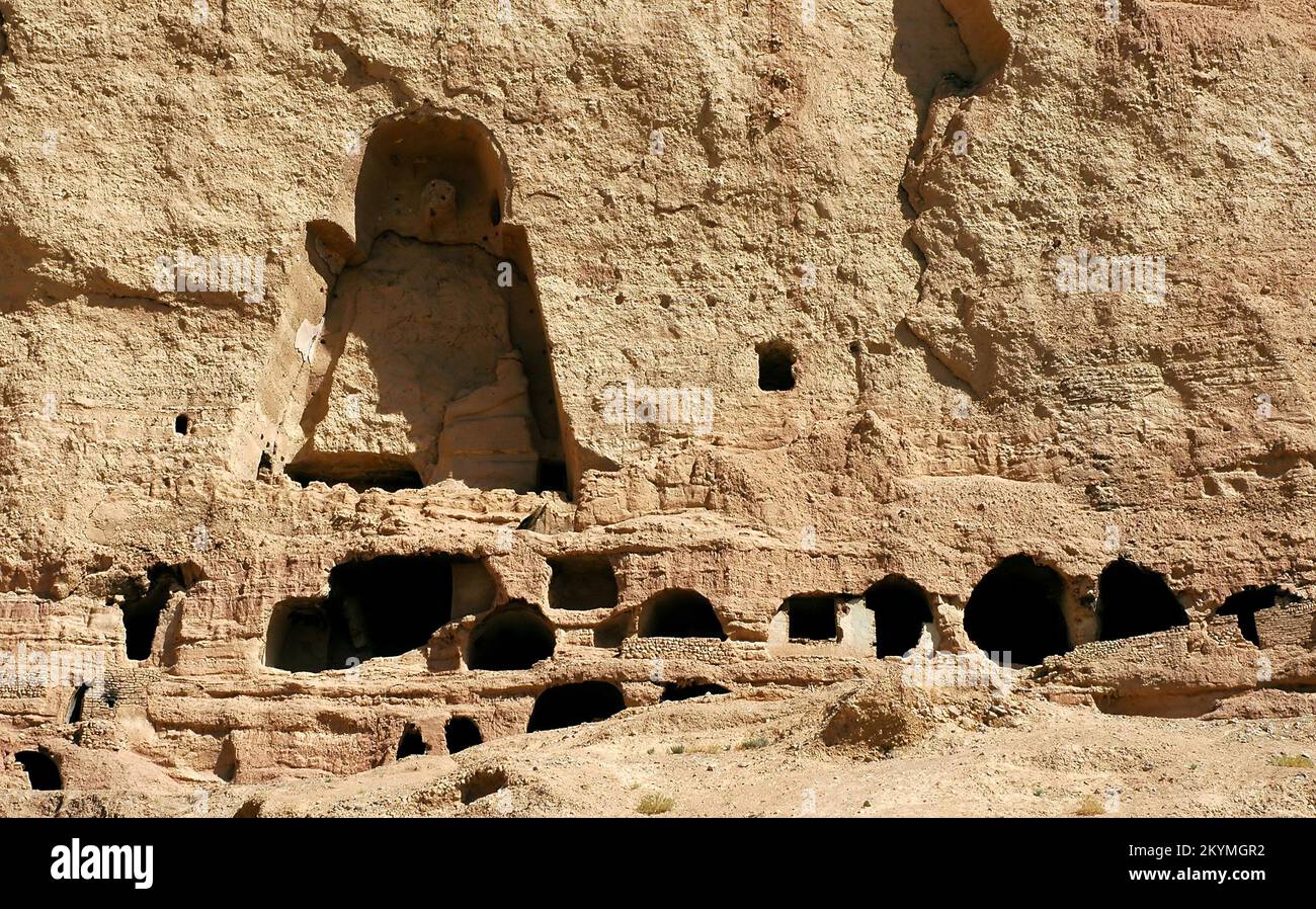 Caves in the cliffs near Bamyan (Bamiyan), Afghanistan. Local Afghan ...