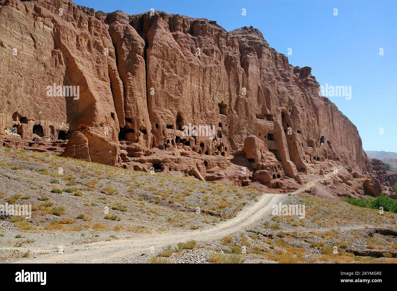 Caves in the cliffs near Bamyan (Bamiyan), Afghanistan. Local Afghan ...