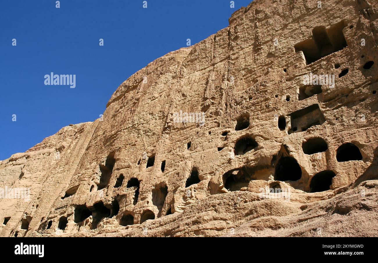 Caves in the cliffs near Bamyan (Bamiyan), Afghanistan. Local Afghan ...
