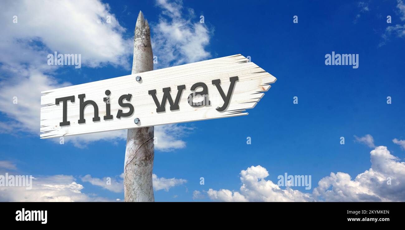This way - wooden signpost with one arrow Stock Photo - Alamy