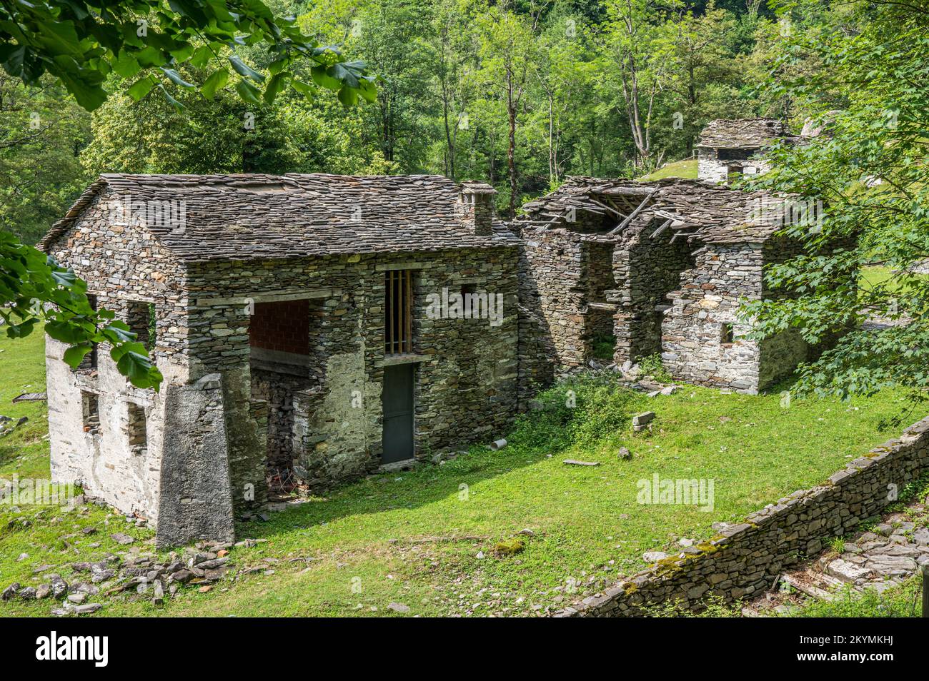 Ruined stone houses and mills in an abandoned mountain village in the ...