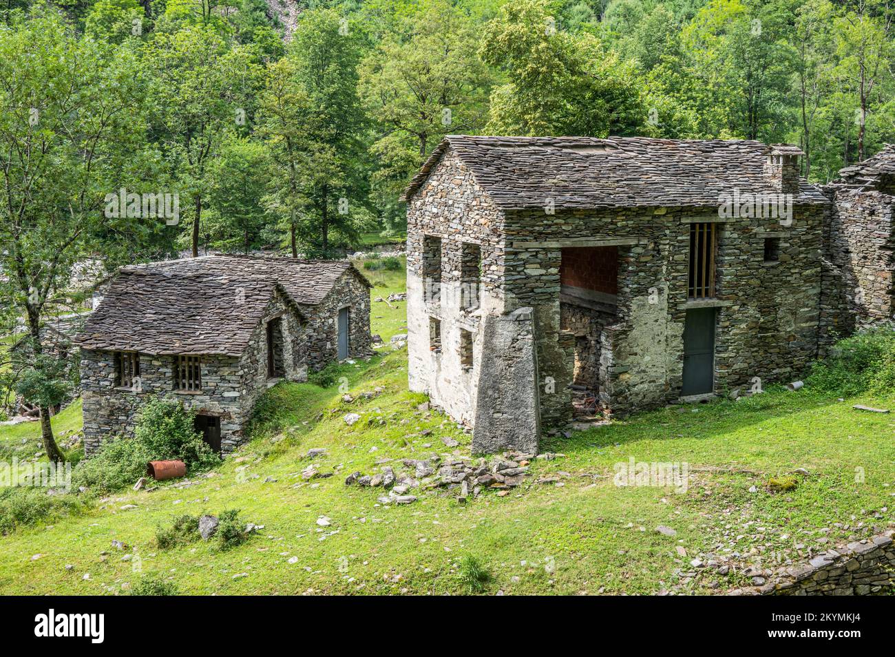 Ruined stone houses and mills in an abandoned mountain village in the ...