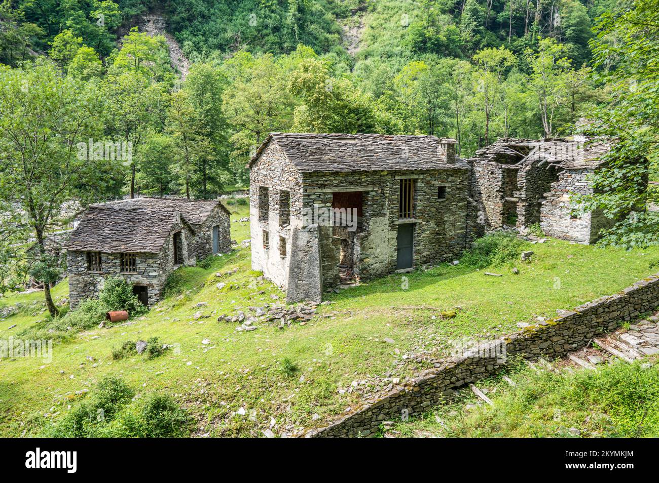 Ruined stone houses and mills in an abandoned mountain village in the ...