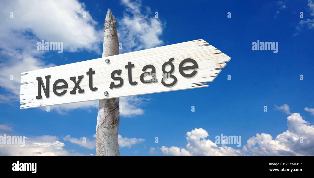 Next stage - wooden signpost with one arrow Stock Photo - Alamy