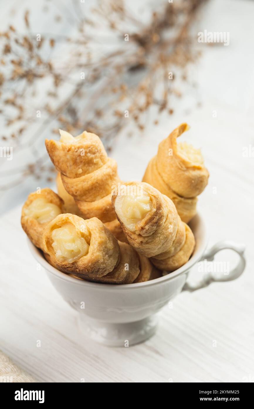 Homemade Pastry Tubes with Whipping Cream in the White Tea Cup ...