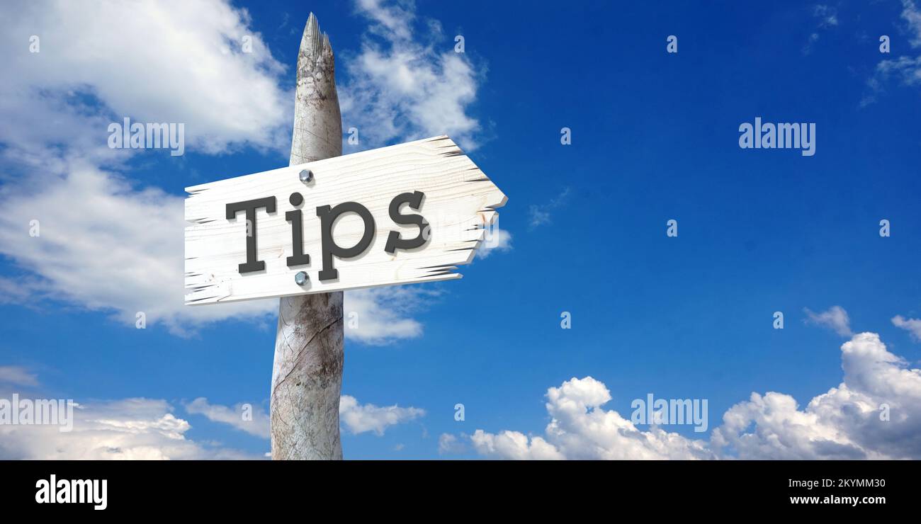 Tips - wooden signpost with one arrow Stock Photo - Alamy