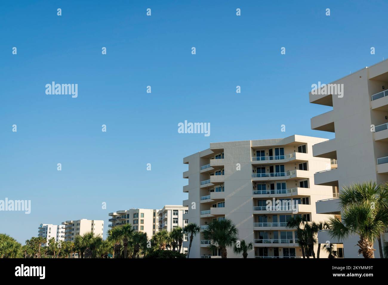 Row of modern mid-rise residential buildings at Destin, Florida. There ...