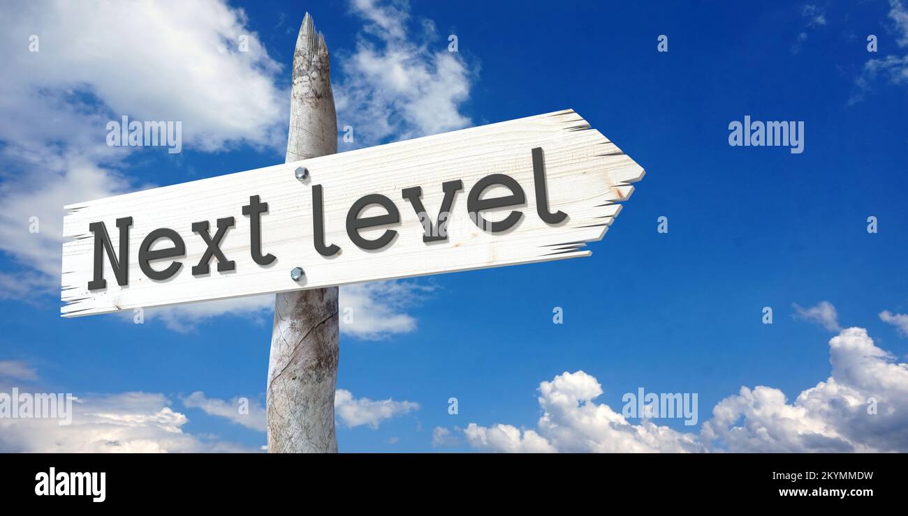 Next level - wooden signpost with one arrow Stock Photo - Alamy