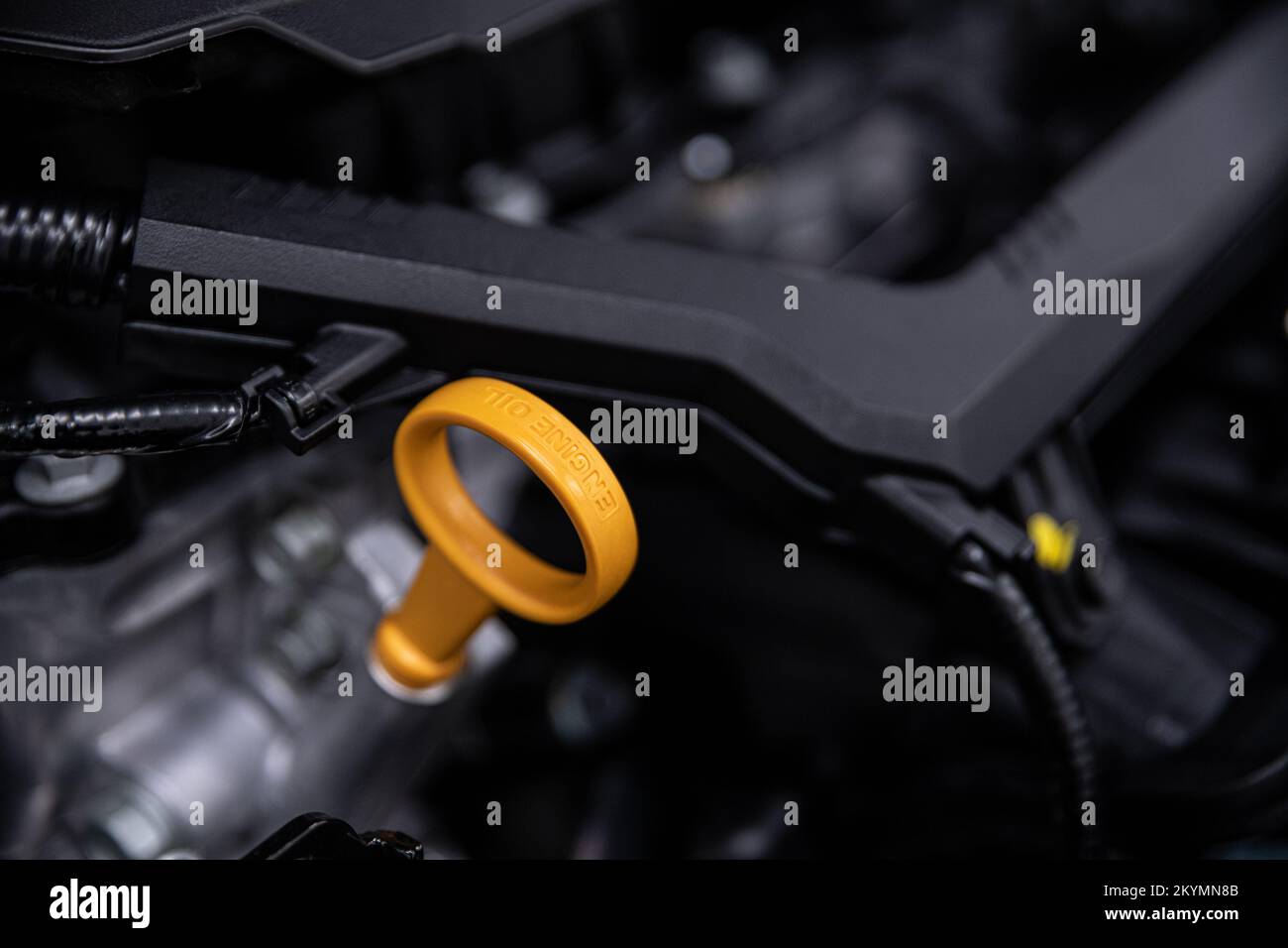 Yellow dipstick for measuring the amount of engine oil in the car Stock ...