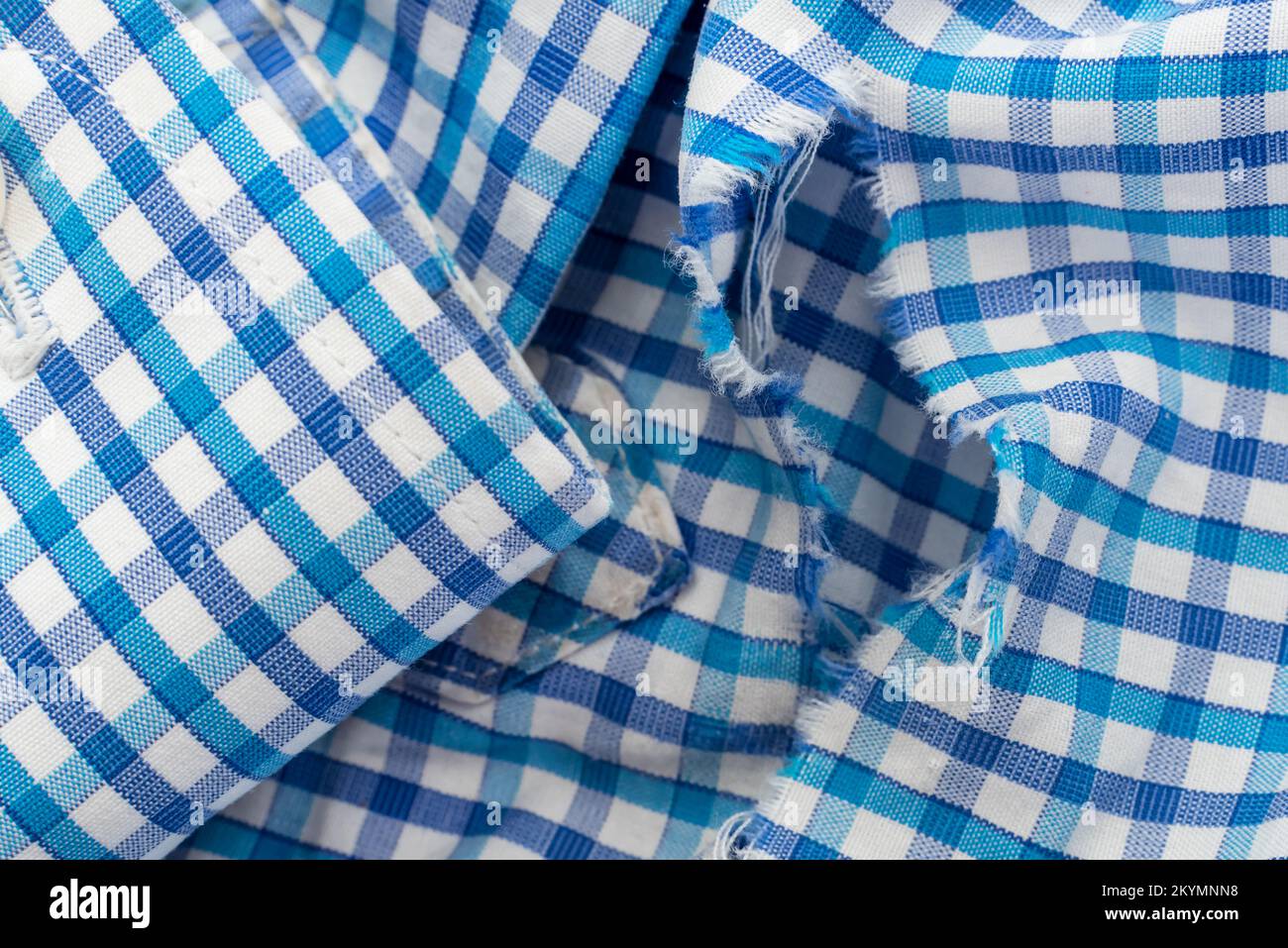 A torn plaid shirt with a hole in the sleeve. Hole in clothes Stock ...