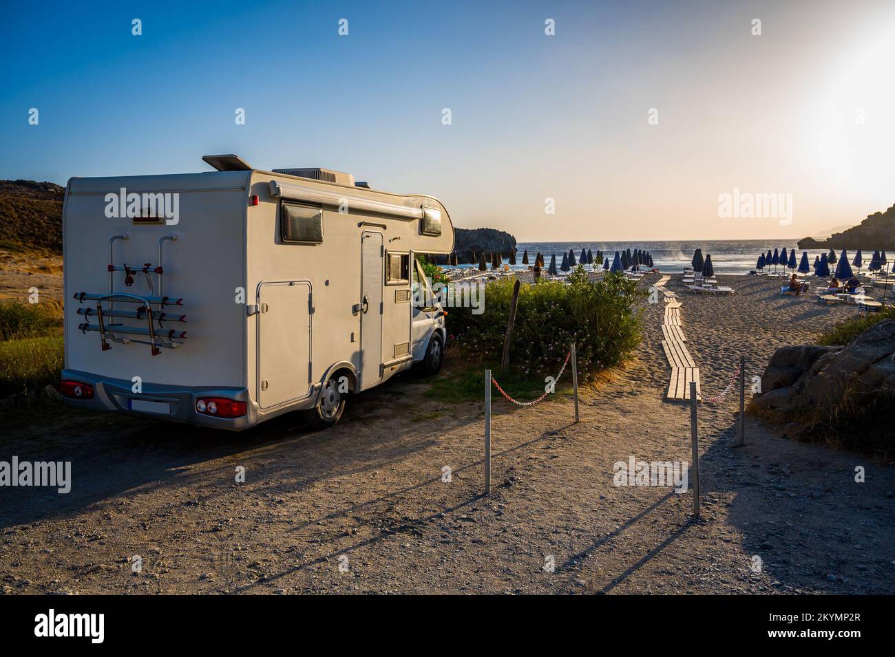Motorhome parked on amazing Skinaria beach, Crete, Greece. Campervan or ...