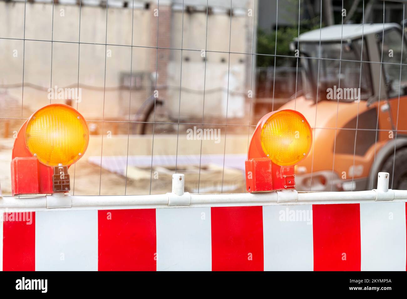 Close-up detail view orange flasher safety blinker light barrier ...