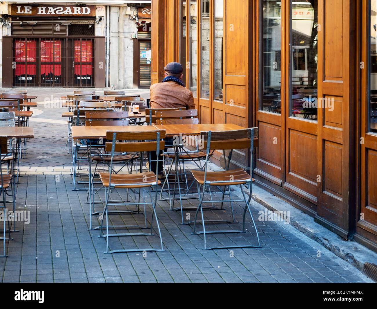 Man sitting alone outside the restaurant Stock Photo - Alamy