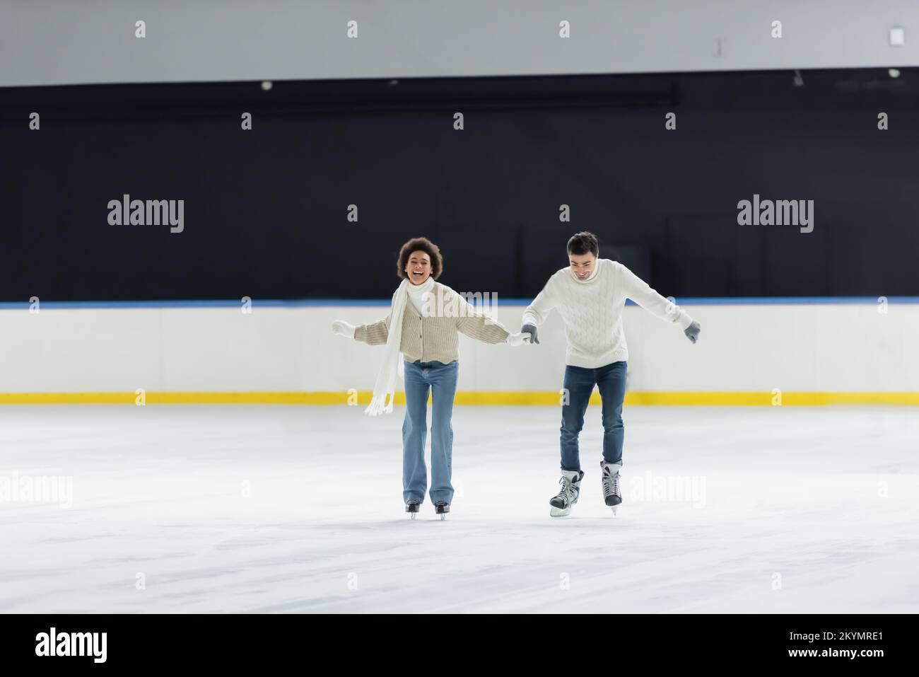 Holding hands ice skating hi-res stock photography and images - Alamy