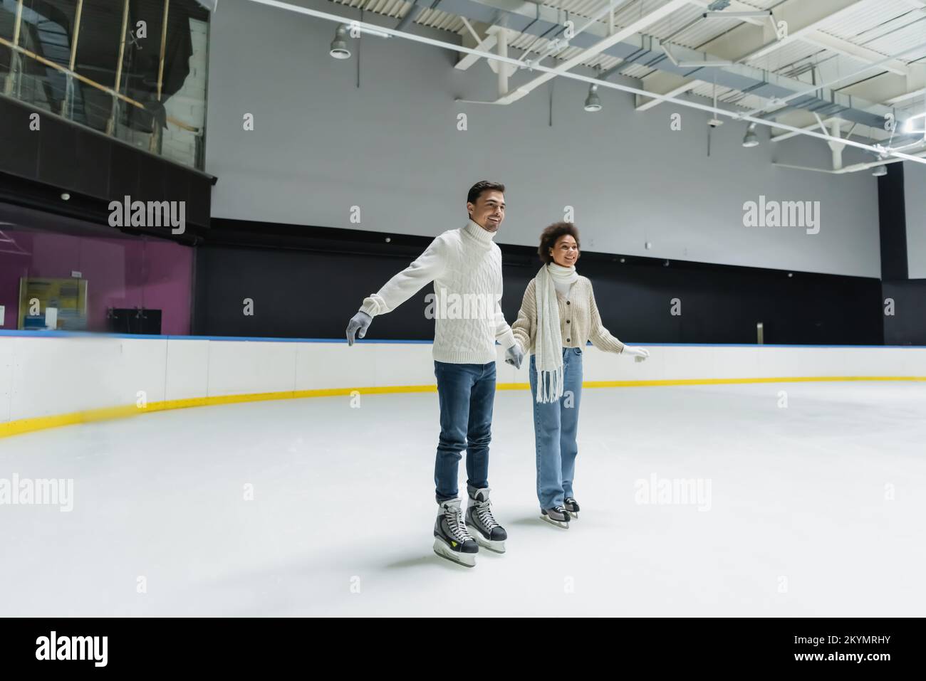 Couple holding hands on ice hi-res stock photography and images - Alamy