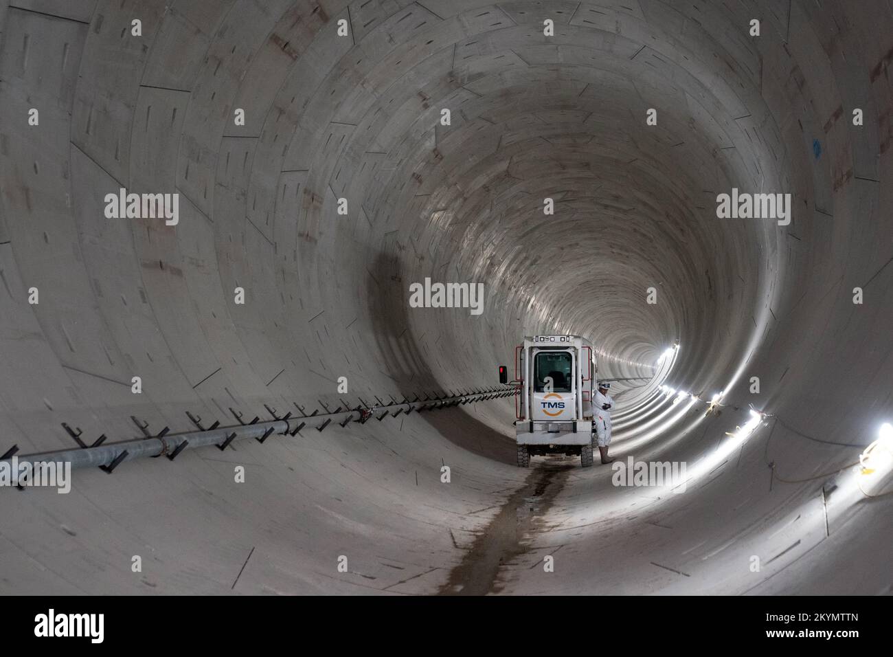 A worker in the one-mile section of the first completed HS tunnel under ...