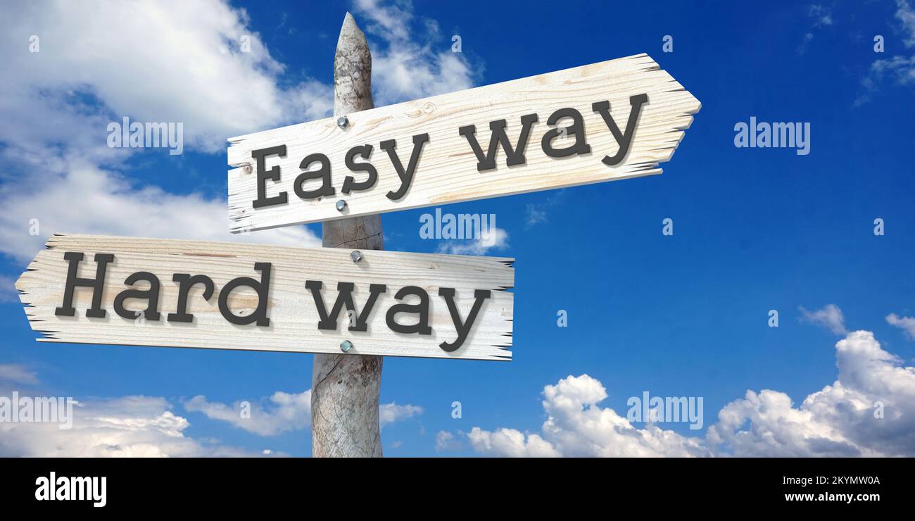 Easy way and hard way - wooden signpost with two arrows Stock Photo - Alamy