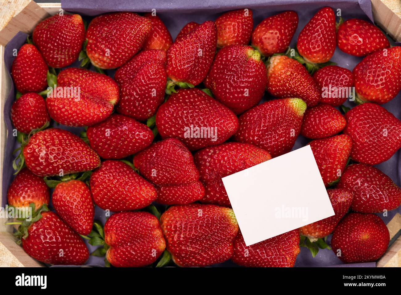still life of strawberries with a label for text Stock Photo - Alamy