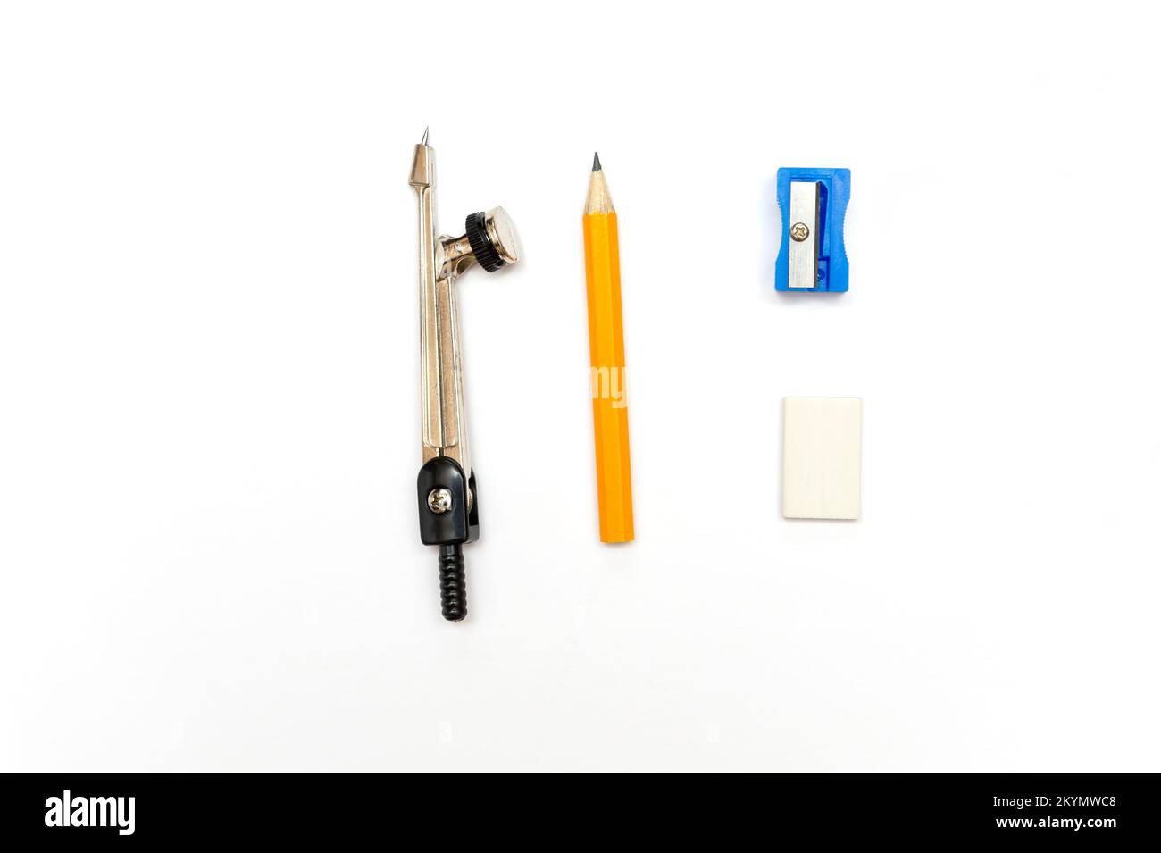 Flat-lay image of a pencil, pencil sharpener, eraser and compass Stock ...