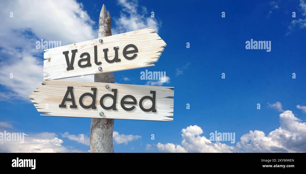 Added value - wooden signpost with two arrows Stock Photo - Alamy