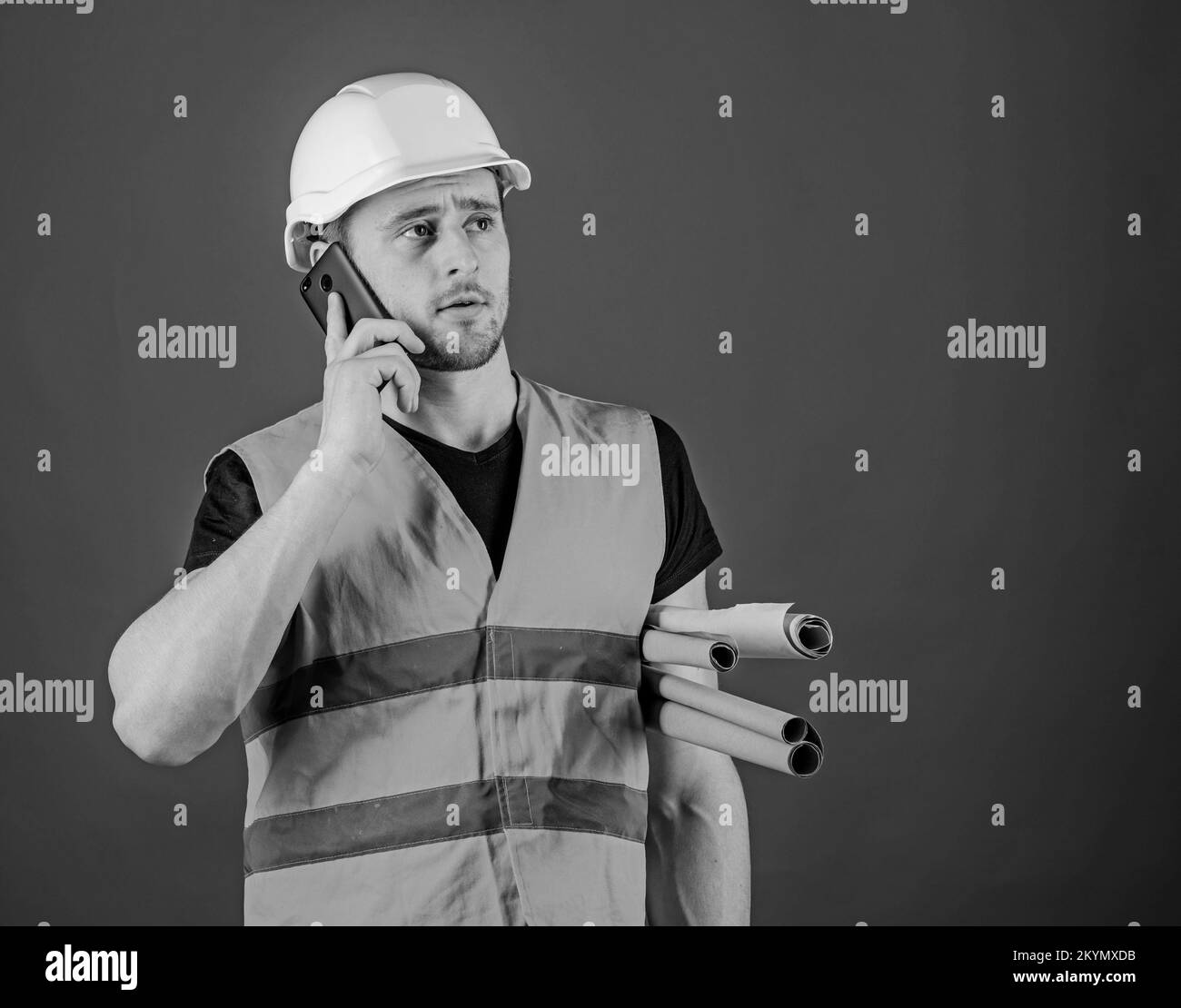 Architect concept. Man, foreman in helmet supervises construction on ...