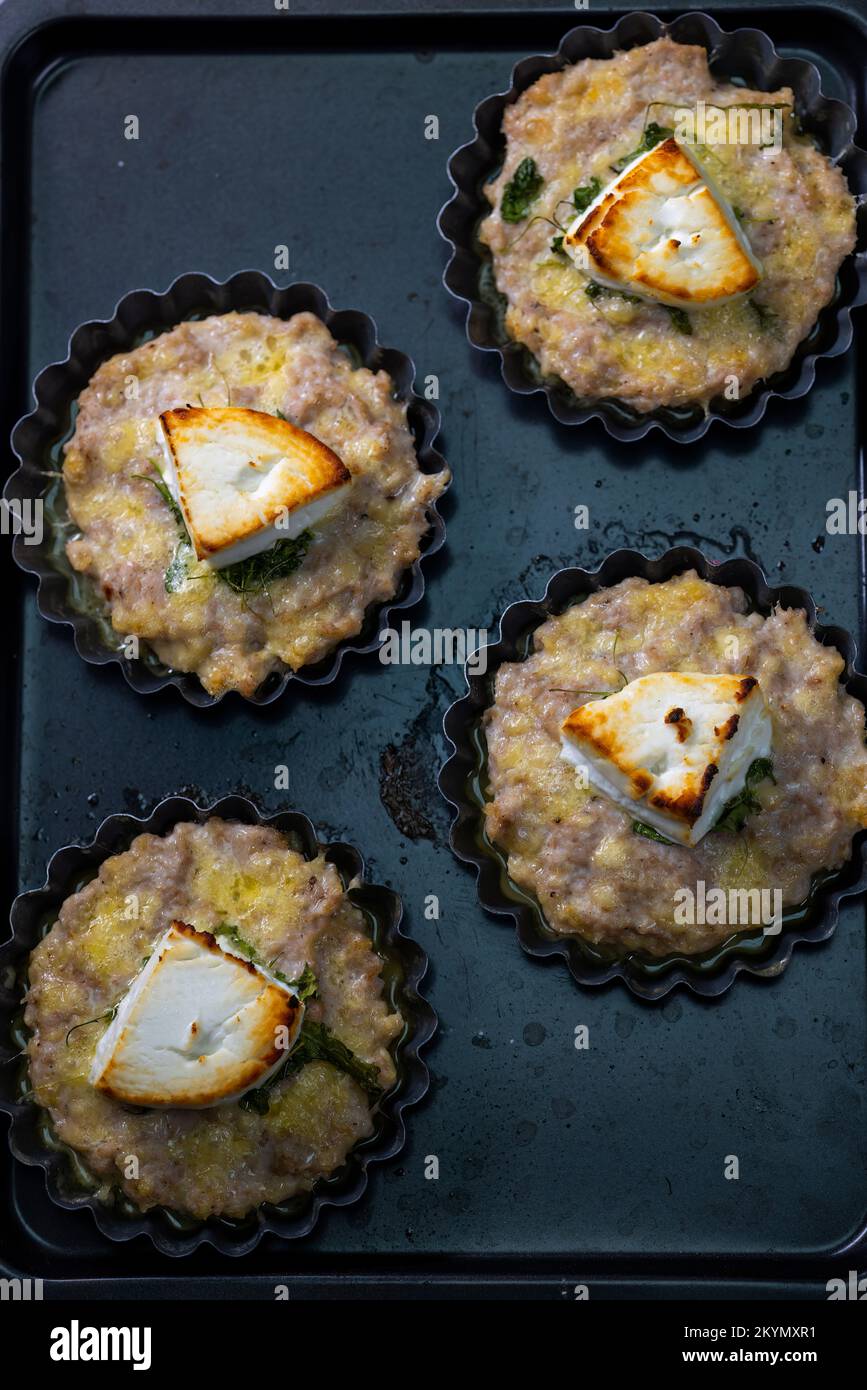 chicken minced meat baked with goat cheese Stock Photo - Alamy