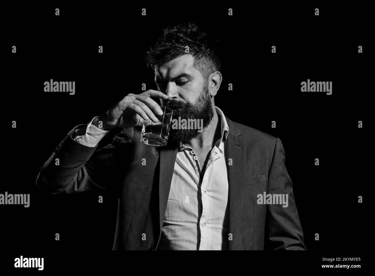 Connoisseur with elegant look drinks cognac or brandy Stock Photo - Alamy