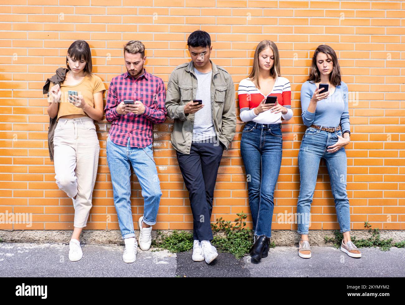 Multicultural people group using smartphone at university college ...