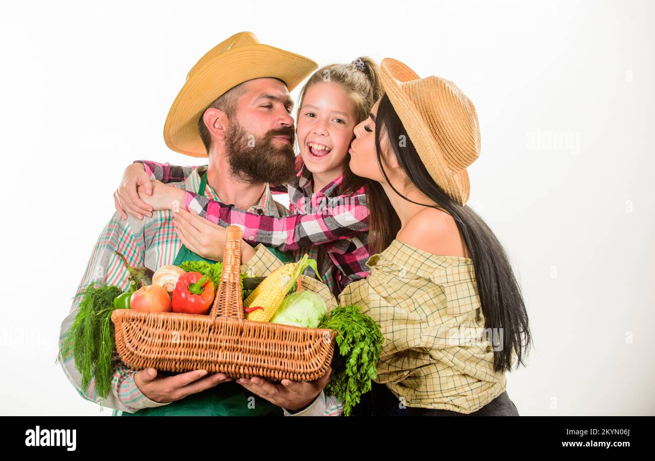 Family farmers hug hold basket fall harvest. Family gardeners basket ...