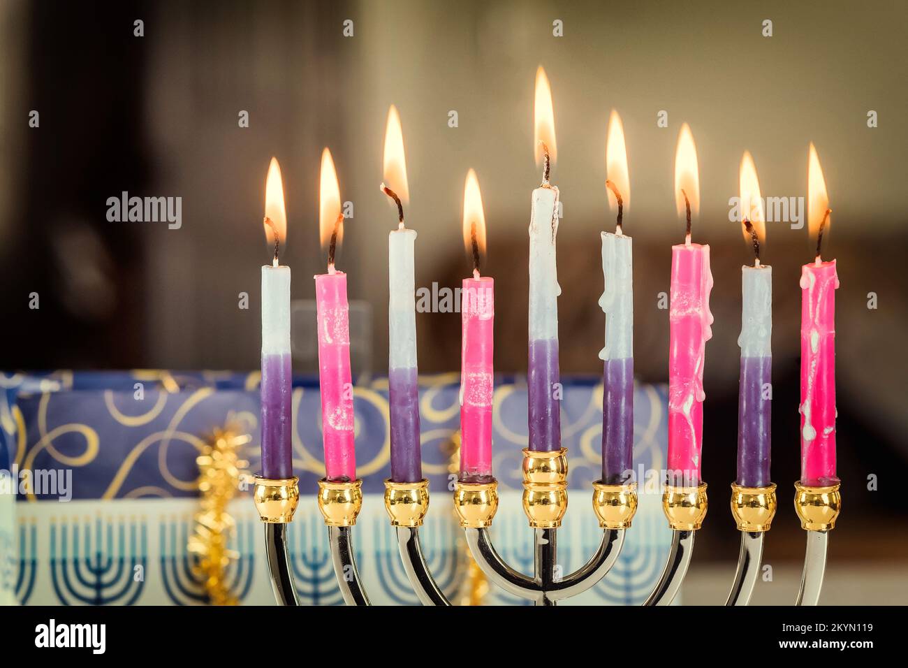 Colorful candles from a burning hanukkah candles in a menorah Selective ...
