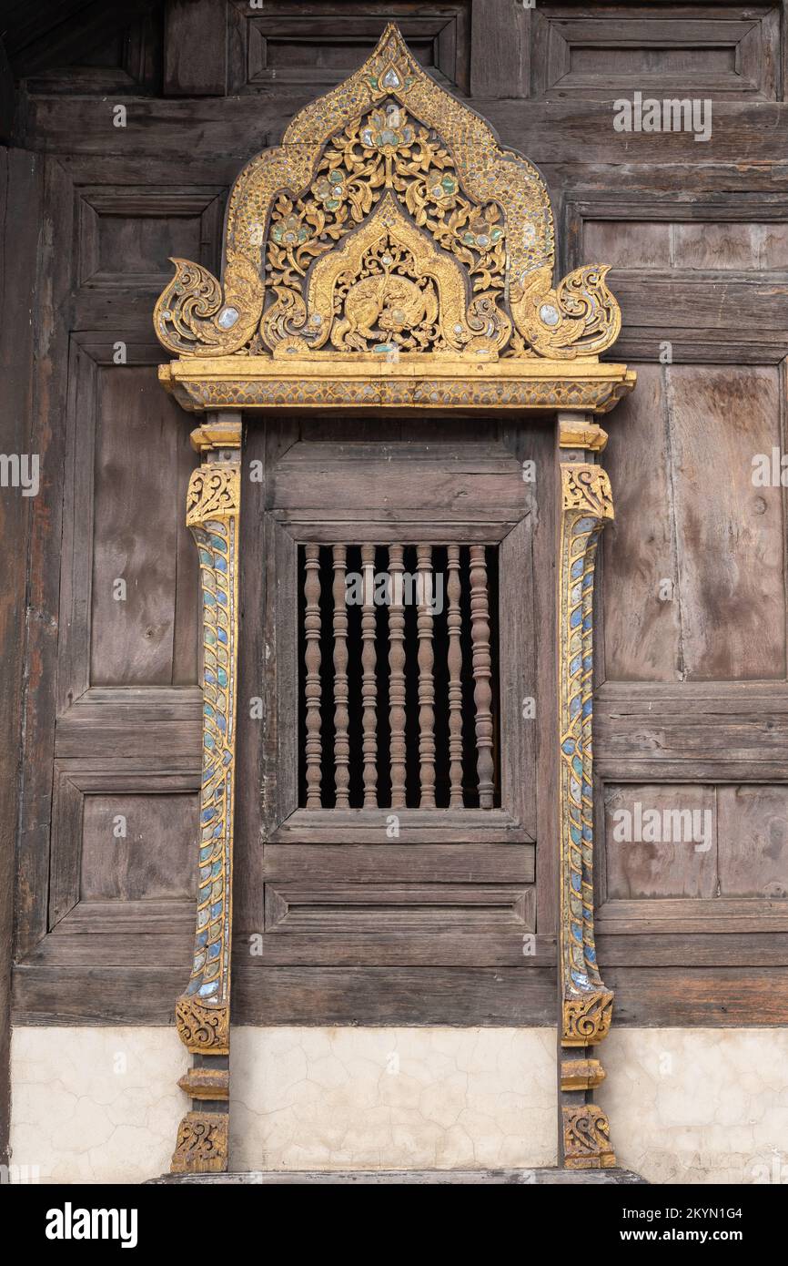 Beautiful window with gilded carved wood panel on heritage landmark Wat ...