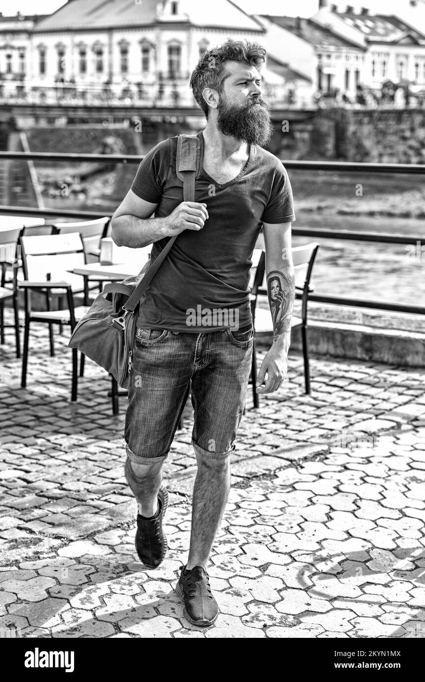 Muscular man with stylish beard and mustache carrying big sporty bag ...