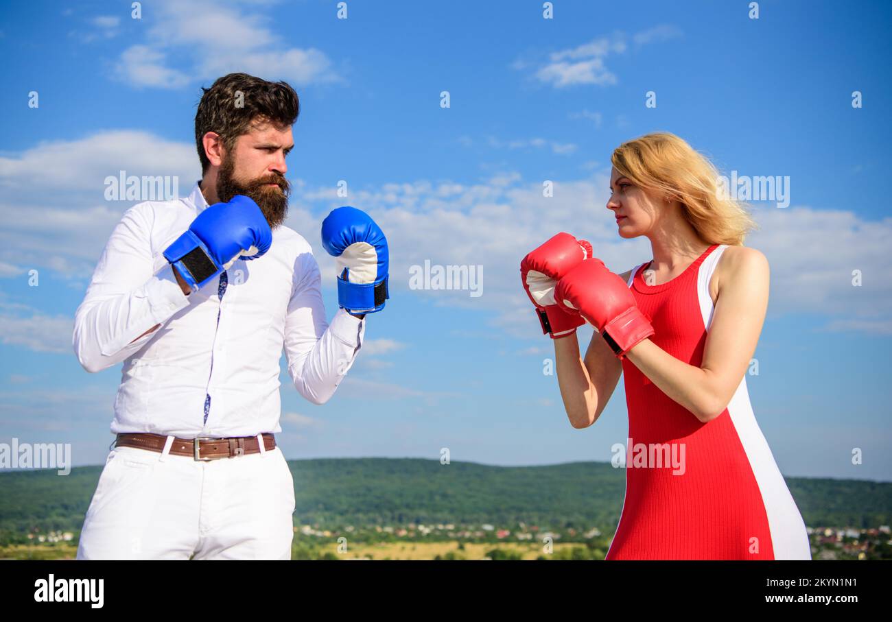 Relations as struggle concept. Man and woman fight boxing gloves blue ...