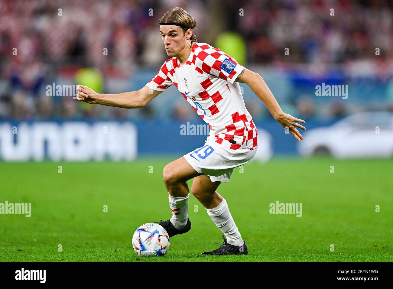 DOHA, QATAR - DECEMBER 1: Borna Sosa of Croatia runs with the ball during the Group F - FIFA ...