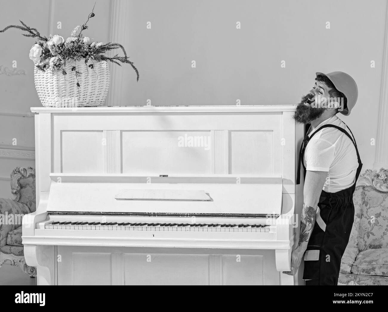 Courier delivers furniture, move out, relocation. Man with beard worker ...