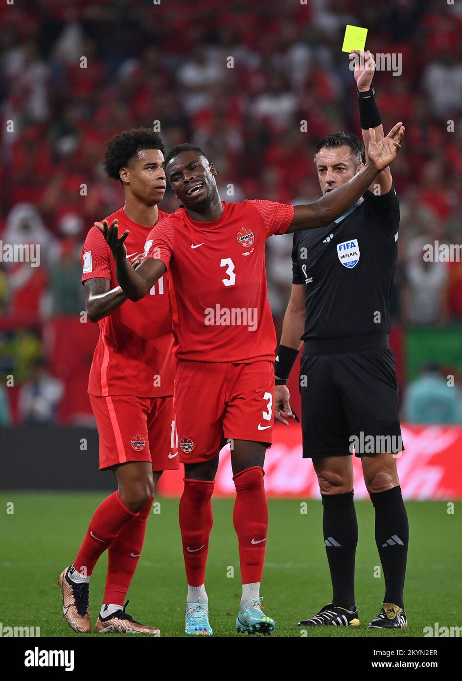 Doha, Qatar. 1st Dec, 2022. Referee Raphael Claus (R) gives Sam ...