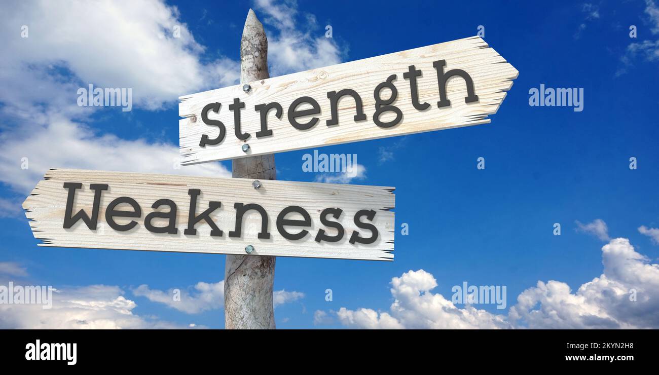 Strength and weakness - wooden signpost with two arrows Stock Photo - Alamy