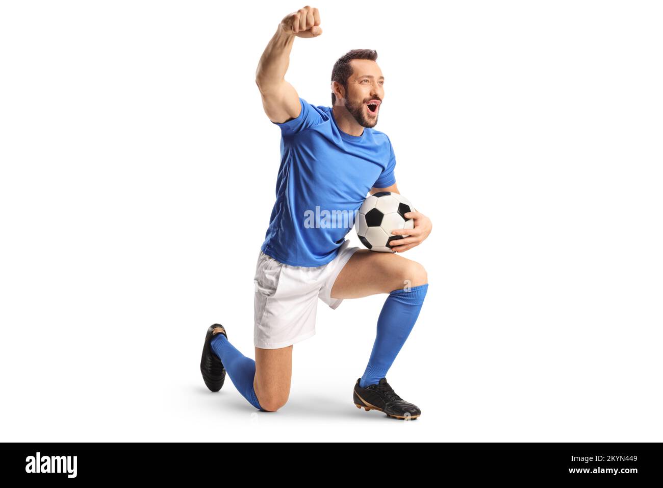 Football player with a ball kneeling and gesturing win isolated on ...