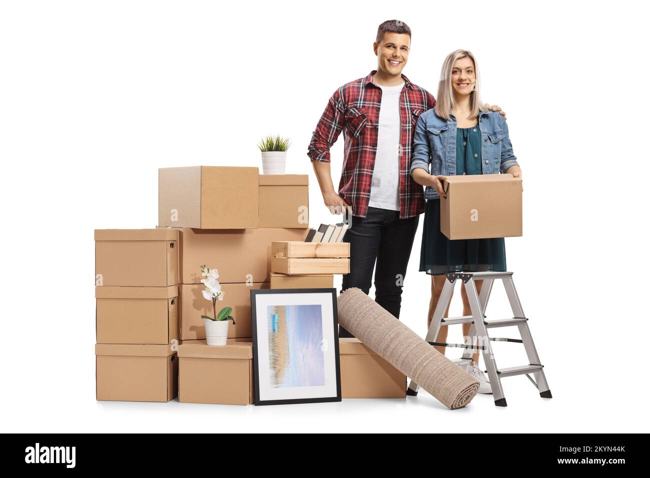 Young couple posing with removal boxes isolated on white background ...