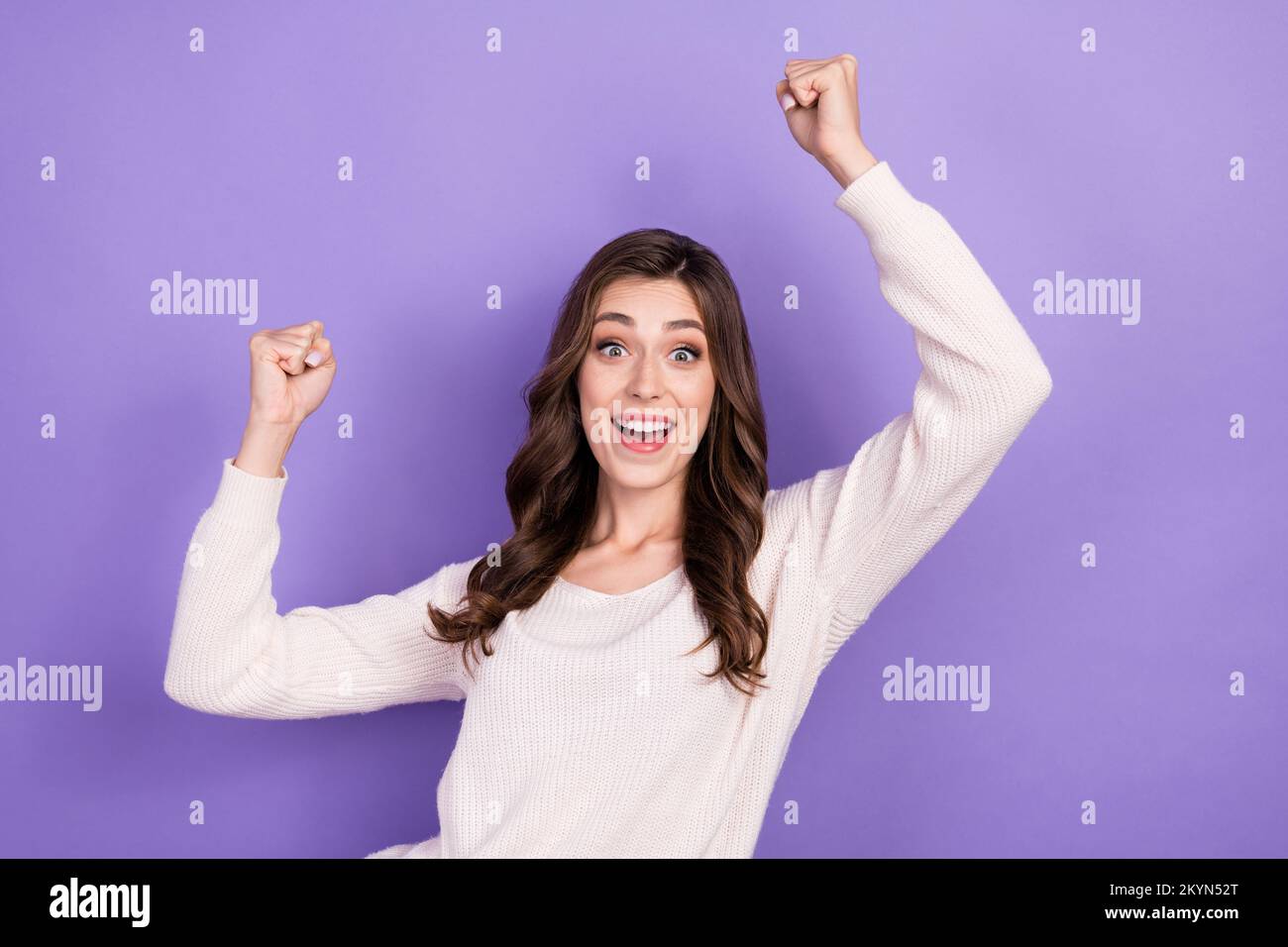 Photo of funky excited woman brunette hairstyle raise hands celebrate ...
