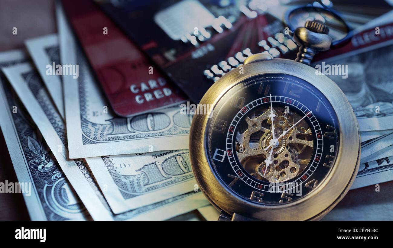 Pocket watch, credit cards and dollars in cash Stock Photo - Alamy