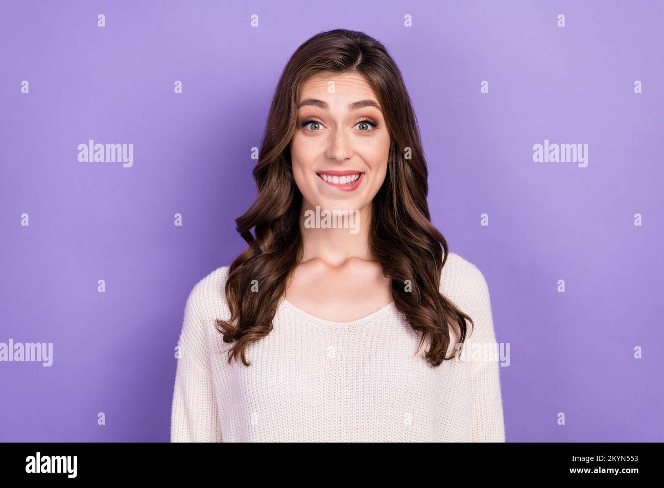 Photo of young cheerful happy lady wear white jumper bite lip teeth ...