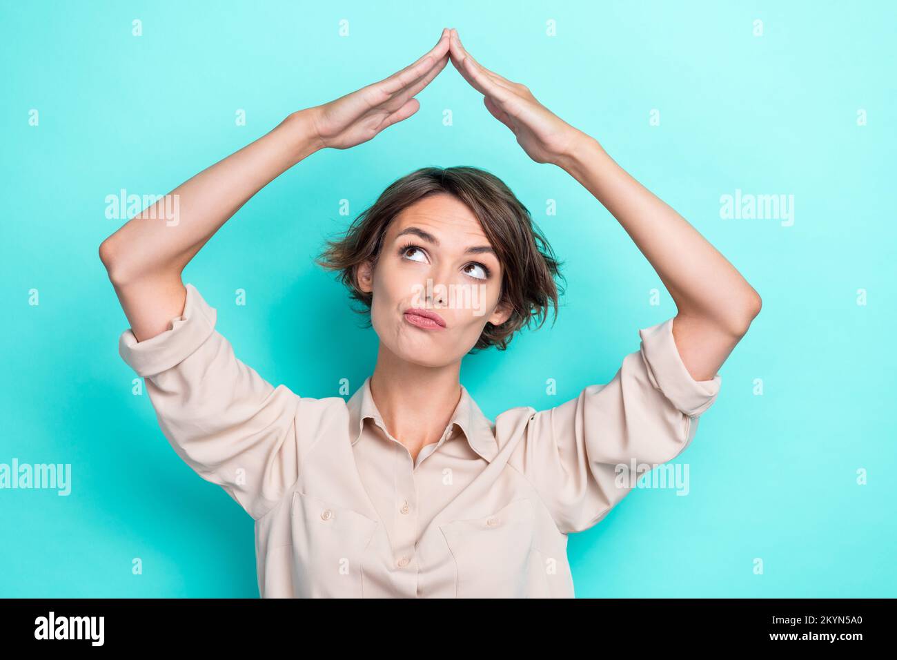 Photo of adorable lady arm make roof under head interested look empty ...